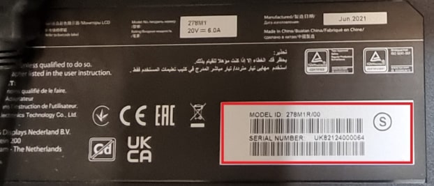 Where to find the model and serial number of a Philips monitor?