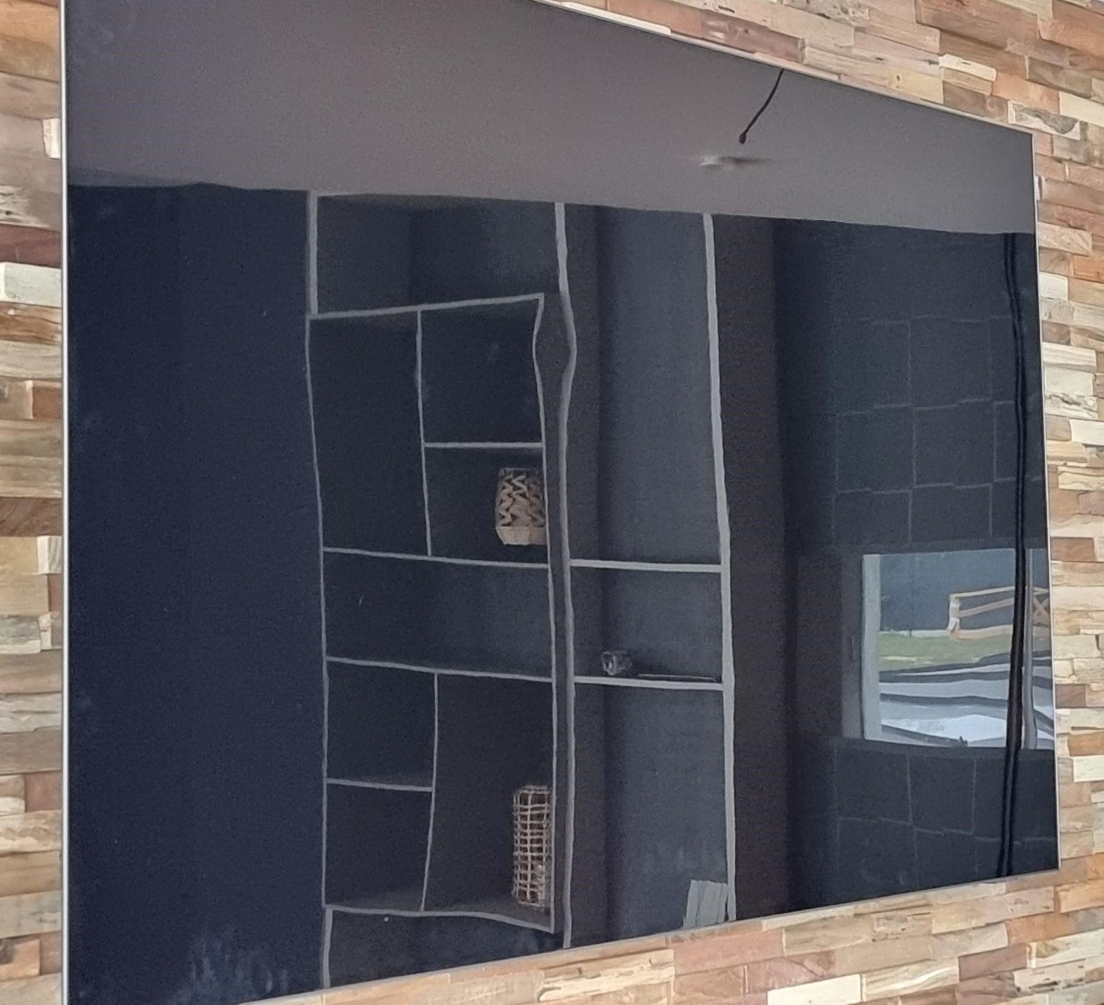 Why are the screen reflections distorted on my Philips OLED TV?